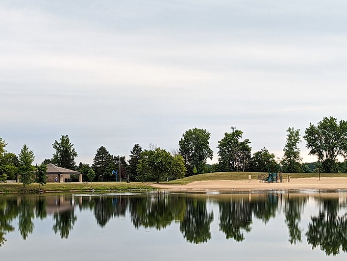 Stratford Woods Park's serene lake mirrors the surrounding trees, creating a double dose of tranquility just minutes from downtown hustle.