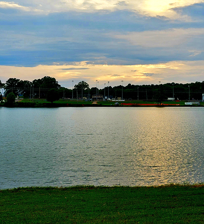 Sunset over Russellville's waterfront paints the sky in retirement-worthy hues, nature's way of saying "slow down and enjoy the view."