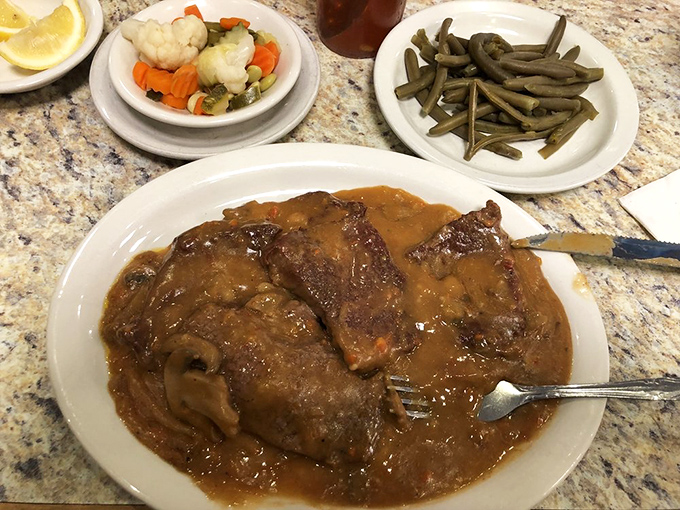 Swiss steak swimming in mushroom gravy with green beans standing at attention &ndash; comfort food that your grandmother would approve of, even if she's not Swiss.