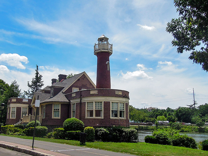 Viewed from across the river, the lighthouse and its reflection create a perfect symmetry. Double the charm, double the magic.