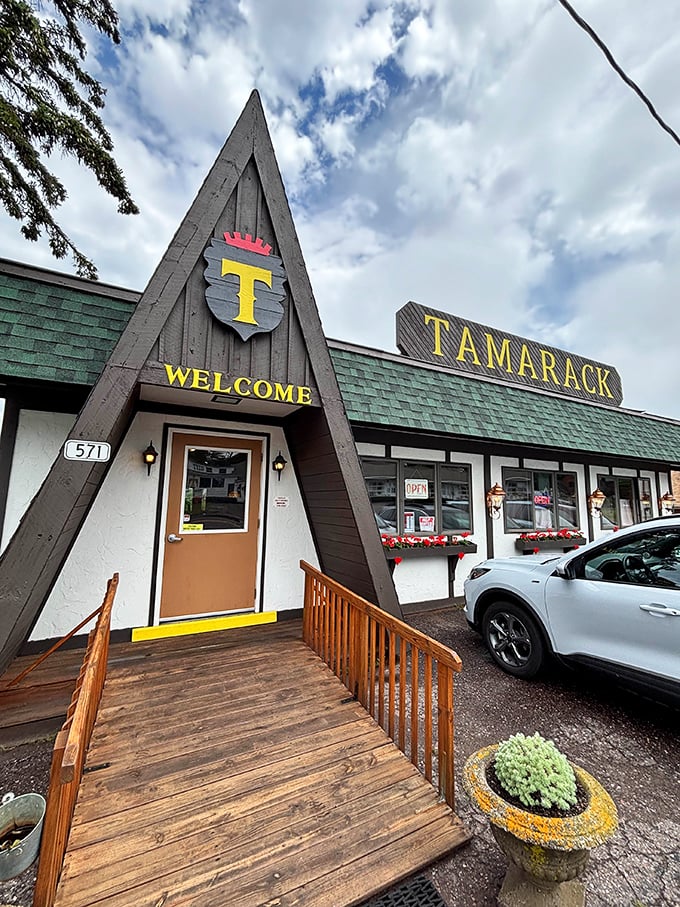 The Tamarack Inn's A-frame entrance practically shouts "Northwoods dining!" with all the subtle charm of a lumberjack at a tea party.