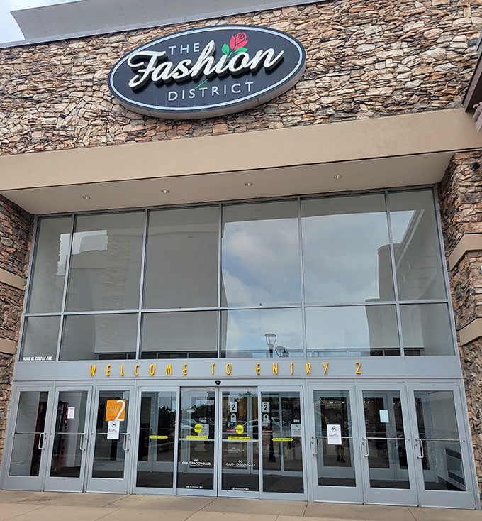 Fashion District entrance promises designer dreams without the nightmare of checking your bank balance afterward.