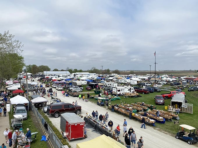 The bird's-eye view reveals the true scale of the What Cheer Flea Market, where hundreds of vendors and thousands of shoppers create a temporary city of commerce.