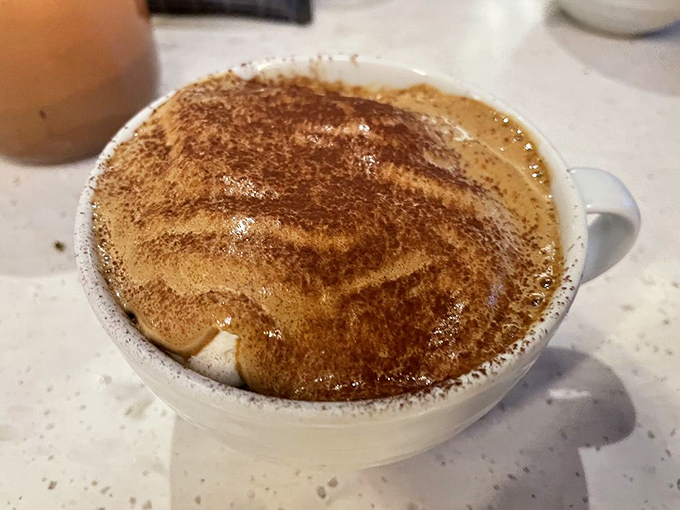 This isn't just tiramisu—it's a perfect stratification of coffee-soaked dreams and cocoa-dusted clouds that makes you wonder why you'd ever waste calories on lesser desserts.