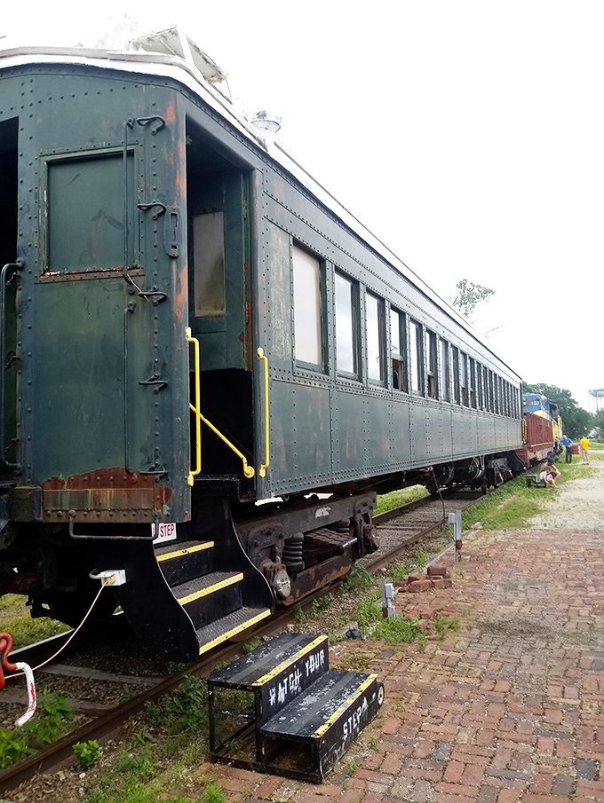 The vintage passenger car entrance invites you to step aboard and imagine journeys when arriving somewhere actually felt like an accomplishment worth celebrating.