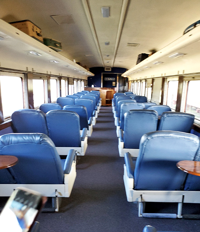 First-class passenger car seating that makes today's airline accommodations look positively barbaric. Those plush blue seats and wooden tables offered civilized travel in an era of genuine elegance.