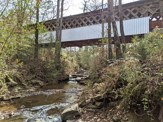 Look up from below and you'll see engineering elegance&mdash;the bridge spanning the creek with a grace that modern concrete structures rarely achieve.