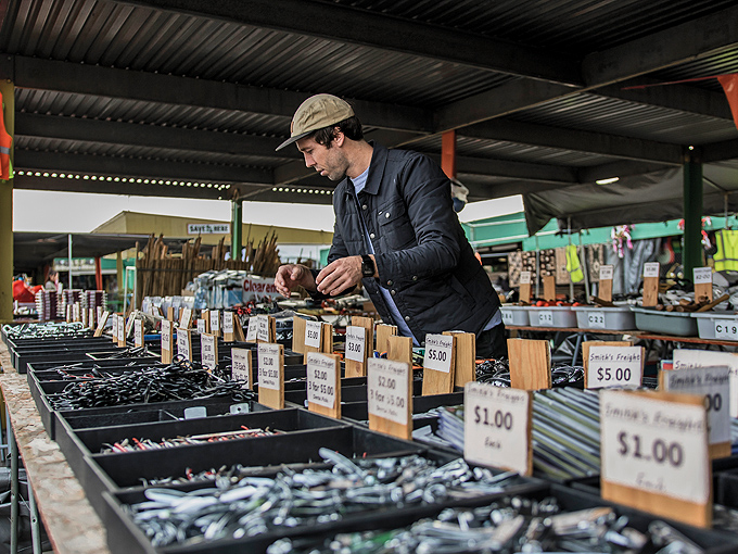 The serious collector examines his wares. There's an unspoken code among vendors: know your stuff or the regulars will know you don't.