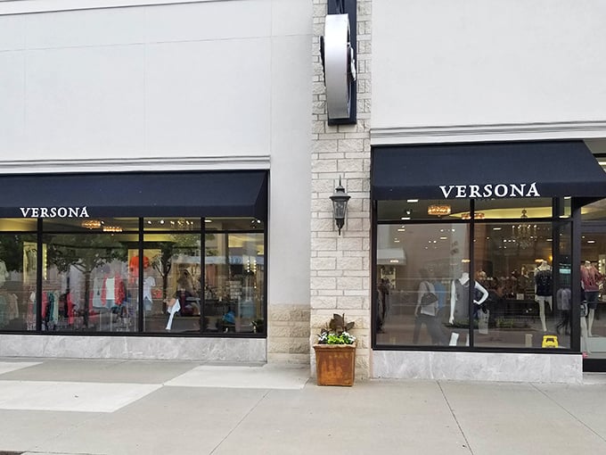 Versona's elegant storefront beckons with promises of affordable fashion treasures. The mannequins seem to whisper, "Yes, you absolutely can pull this look off."