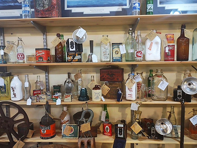 Bottles and tins that once held everyday products, now transformed into collectible art. Madison Avenue's finest work, preserved on shelves.
