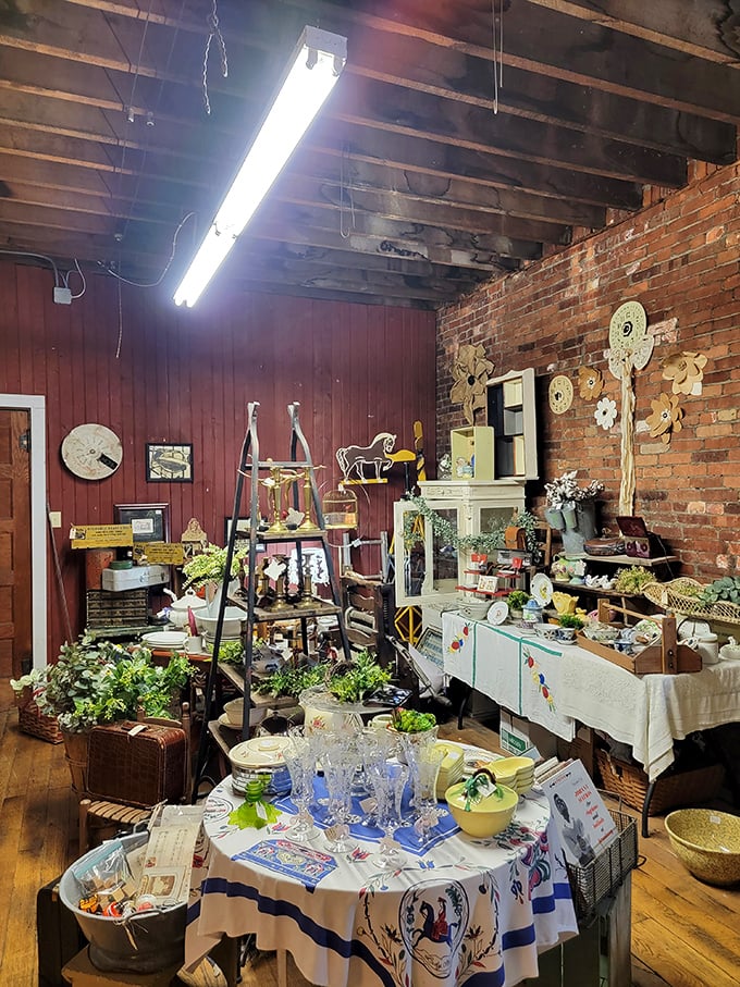 The glassware catches the light while Pennsylvania Dutch motifs adorn the tablecloth. Every item here has survived decades to find its next home.