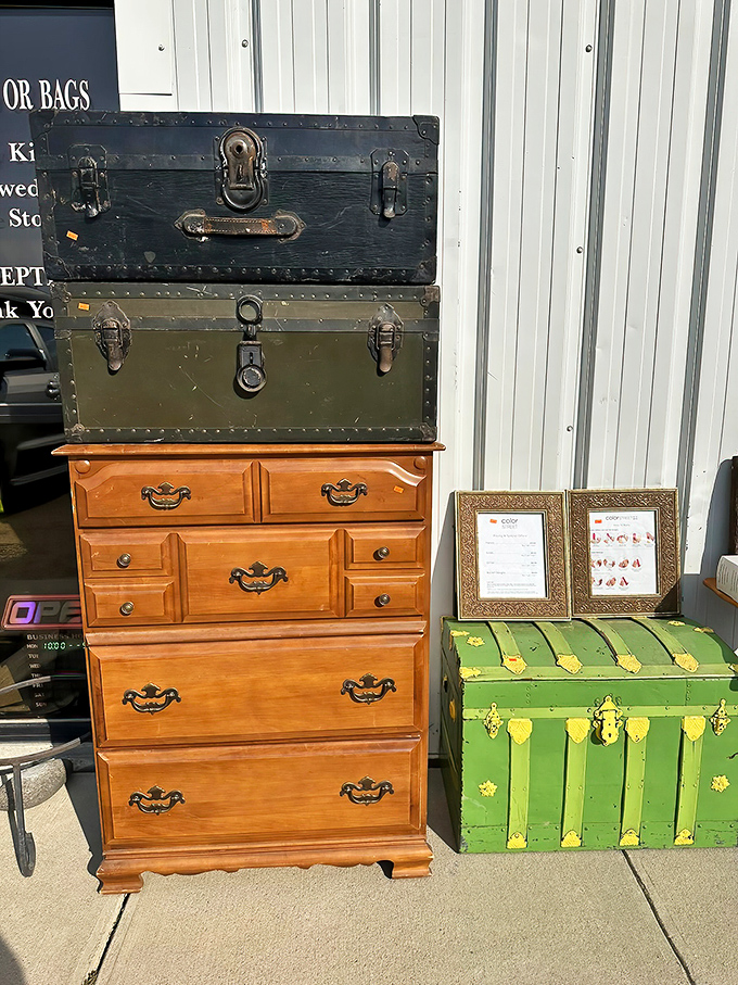 Vintage furniture and trunks stand like sentinels of bygone eras. That green chest probably held someone's treasures&mdash;now it could hold yours.