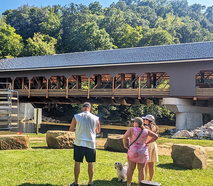 Families gather to admire the bridge, proving that sometimes the best vacation memories don't require admission tickets or gift shops.