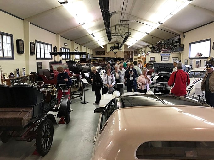 The true measure of any great museum: visitors gathered in rapt attention, creating memories while surrounded by machines that defined their grandparents' youth.