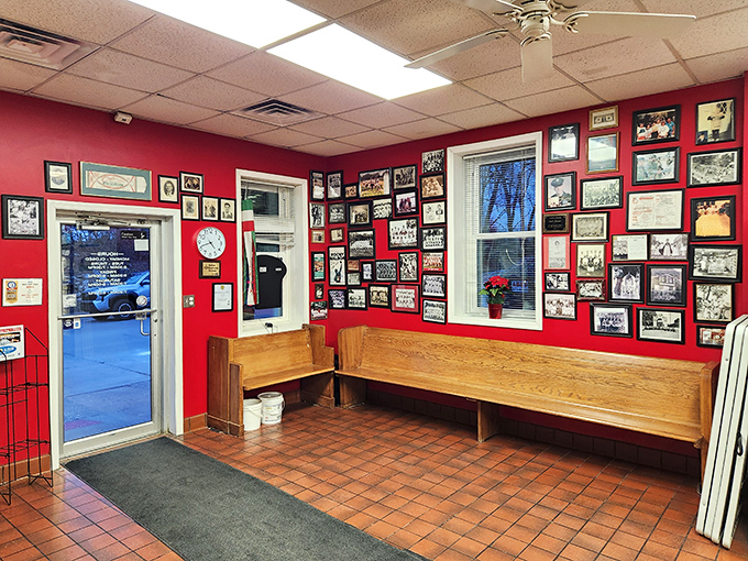 The red wall of fame. This vibrant entrance area showcases decades of community connections—a visual reminder that you're not just eating food, you're tasting history.