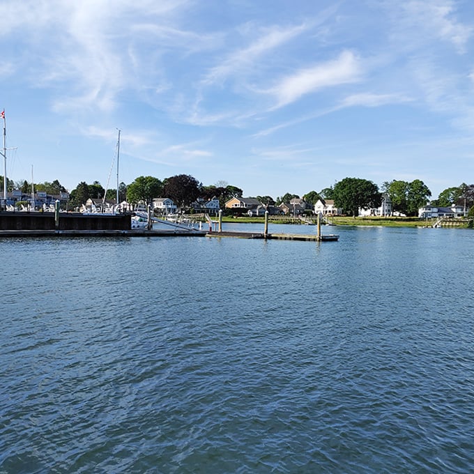 Milford Harbor's calm waters reflect the community that surrounds it. Boats, homes, and history blend in perfect waterfront harmony.