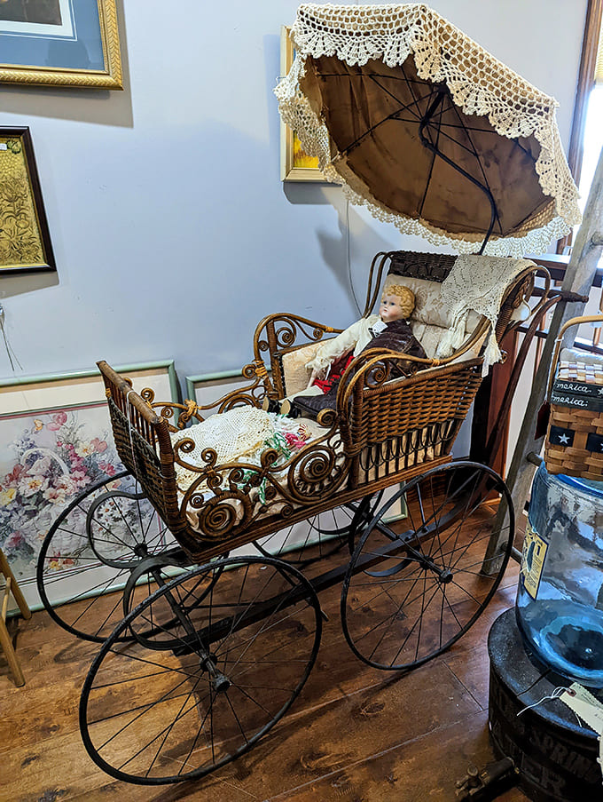 Victorian-era baby carriage that makes modern strollers look like shopping carts. Complete with porcelain doll passenger who's definitely not haunted. Probably.