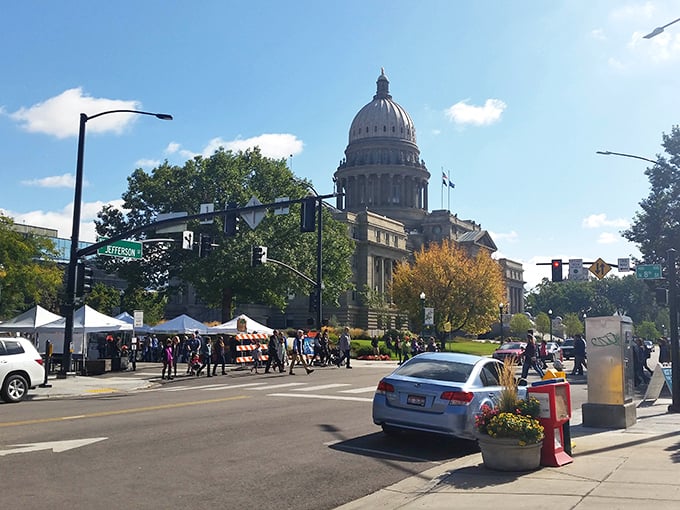 The Idaho State Capitol stands sentinel over the market, a limestone reminder that even government buildings look better with farmers markets in front.