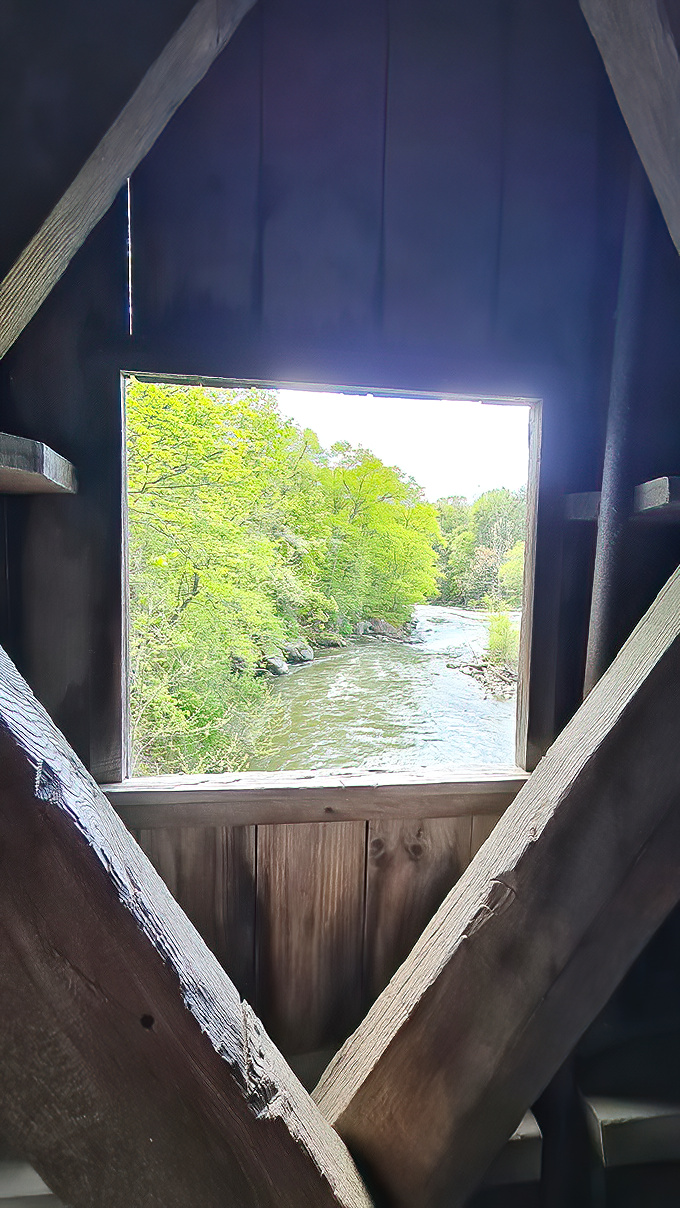 Peering through the bridge's window offers a framed masterpiece of flowing water and verdant banks&mdash;nature's artwork through a historical lens.