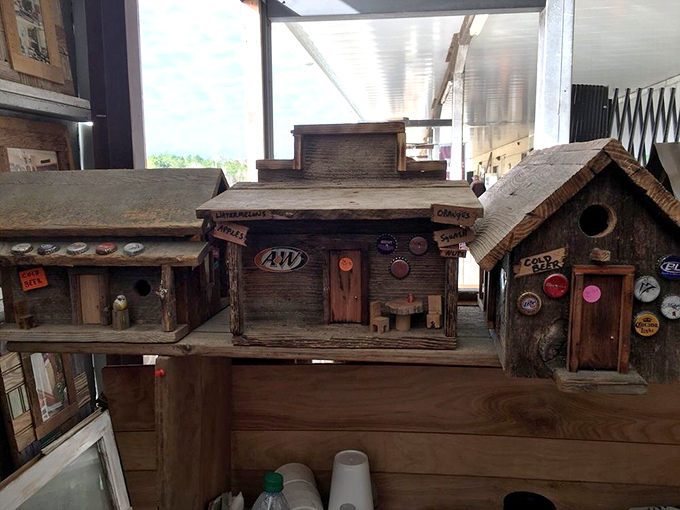 Whimsical birdhouses crafted from weathered wood and vintage bottle caps. Even the birds in Mississippi appreciate a home with character! 