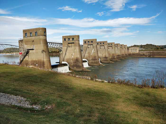 These concrete sentinels have been managing the river's moods longer than most of us have been alive, turning raw power into electricity with industrial grace. 