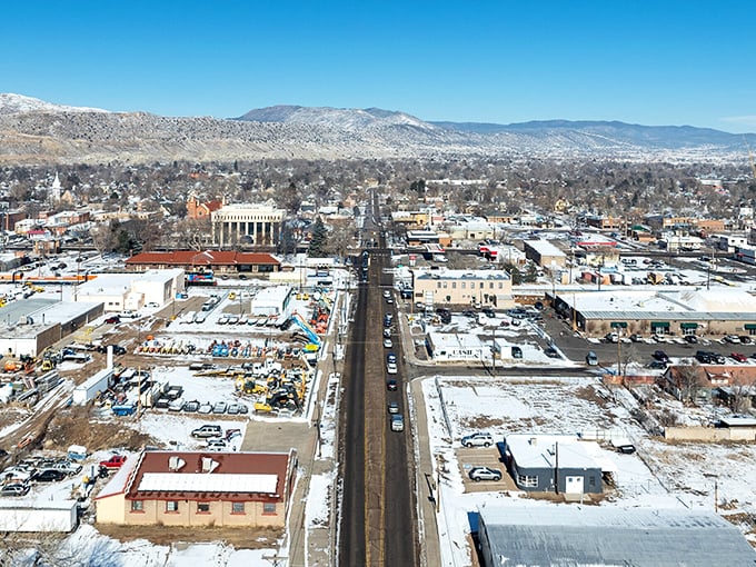 From above, Ca&ntilde;on City reveals itself as a perfect grid of human ambition nestled between mountains that couldn't care less about our plans.