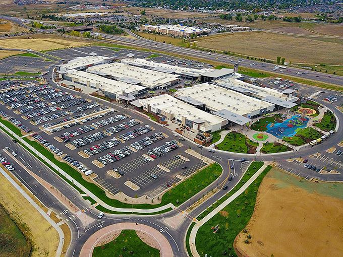 From above, Denver Premium Outlets resembles a retail mothership that has landed in Thornton, its parking lot a constellation of cars drawn to savings.