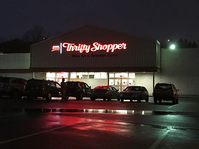 As night falls, the glowing sign serves as a beacon for last-minute shoppers &ndash; proof that bargain hunting doesn't follow a 9-to-5 schedule.