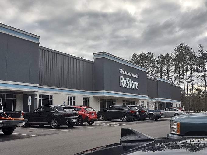 The parking lot view reveals the true scale of this treasure trove. Cars lined up like eager bargain hunters themselves.
