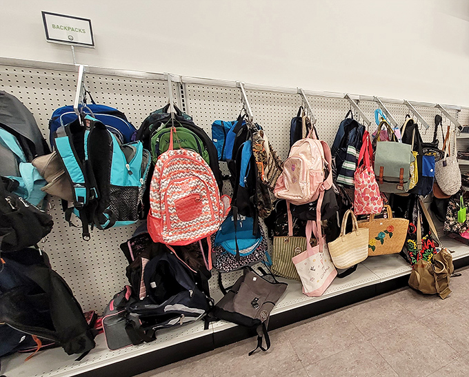 Backpack bonanza! From school essentials to hiking companions, these colorful carriers hang like exotic fruit waiting to be plucked.