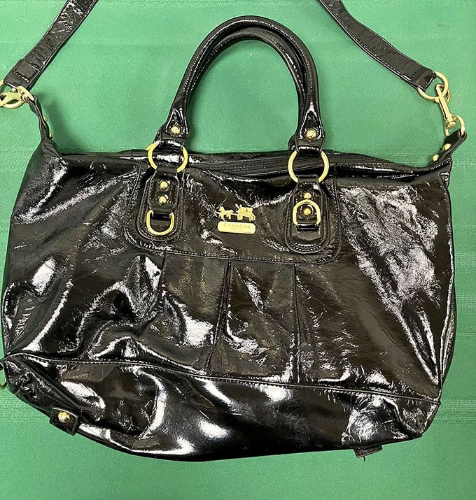 Designer style without the designer price tag. This sleek handbag didn't end up here because it wasn't loved—it's waiting for its second chapter of glamour.