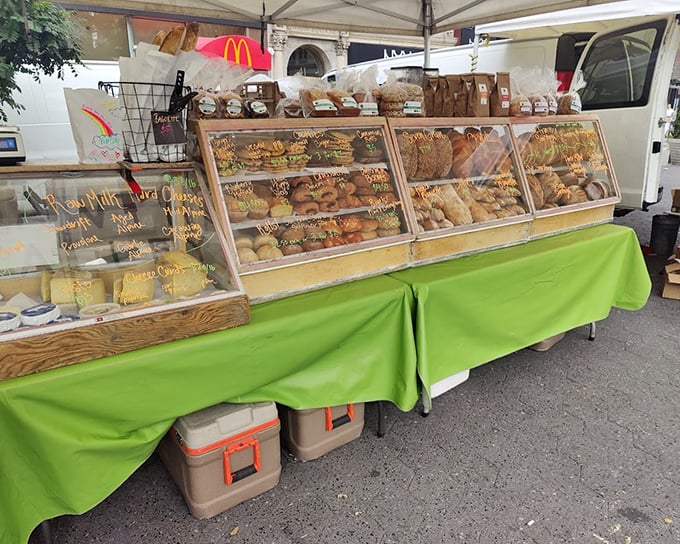 Artisanal baked goods under glass showcase carbohydrate perfection that would make any food lover swoon.