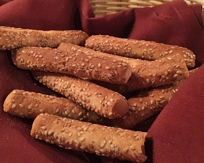 Sesame breadsticks hot from the oven are dangerous because you'll fill up before the main event arrives.