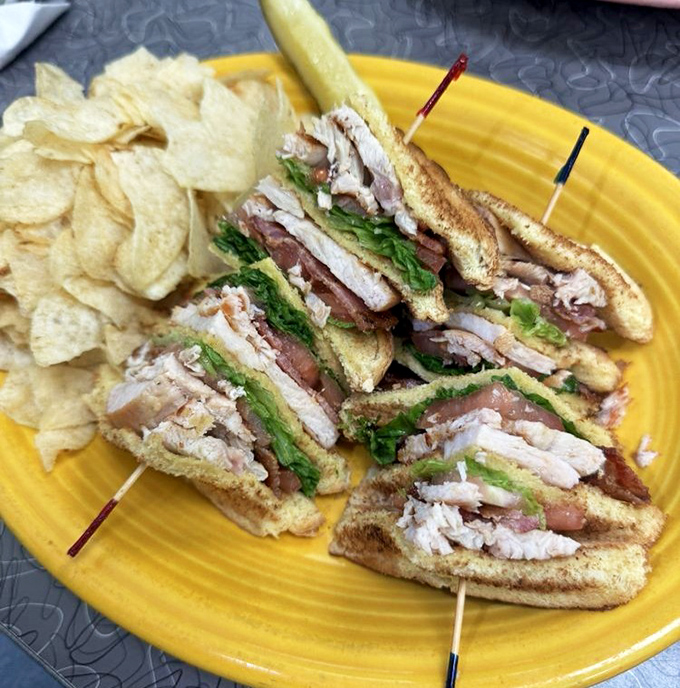 The Cali club sandwich cut into triangles &ndash; because geometry makes everything taste better, especially with that pickle spear.
