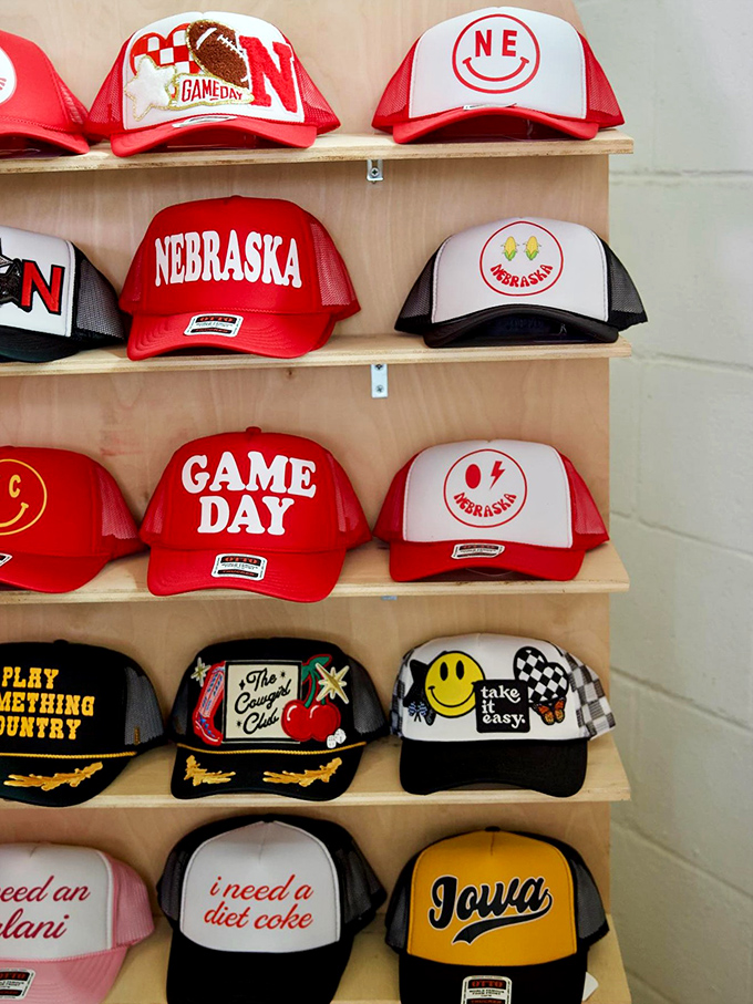 Nebraska pride on full display! These trucker hats celebrate Cornhusker football, local humor, and the occasional nod to neighboring Iowa&mdash;brave move.