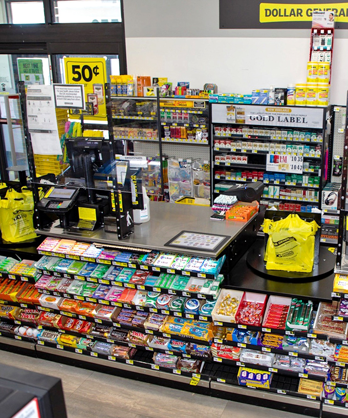 The final frontier—the checkout, where impulse buys tempt even the strongest willpower. Candy, gum, and last-minute necessities stand guard by the register.