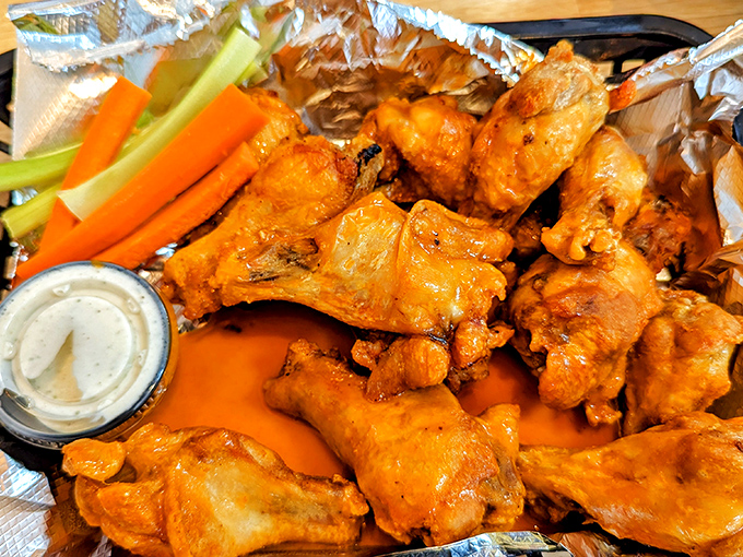 Wings that don't need a sports bar to shine &ndash; crispy, saucy, and unapologetically messy. Those celery sticks are fooling no one about the healthiness of this plate.