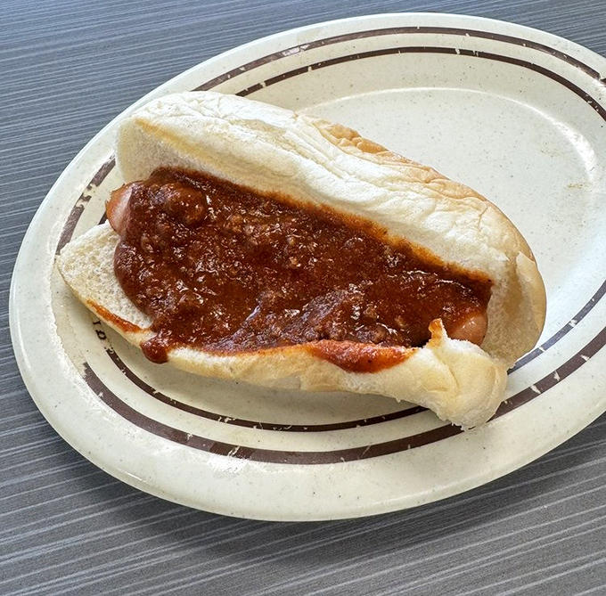The classic chili dog in its natural habitat&mdash;a simple plate that lets the star shine. Sometimes perfection needs no embellishment.