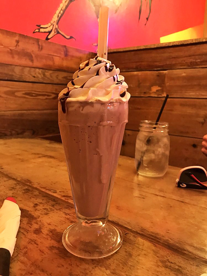 This chocolate milkshake isn't just a drink&mdash;it's a towering monument to indulgence, topped with a cloud of whipped cream that touches the heavens.