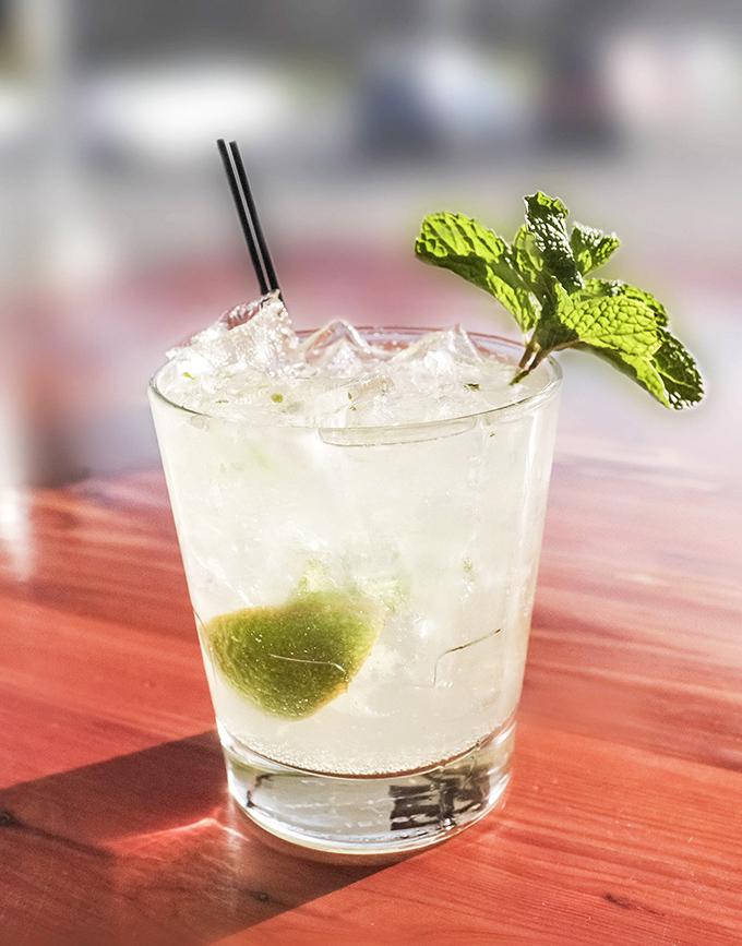 A refreshing moment of clarity in a haze of smoke and meat. This cocktail cuts through richness like a well-timed joke.