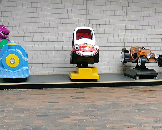 Even the kiddie rides maintain the outlet mall's promise: fun experiences that don't empty your wallet before the real shopping begins.