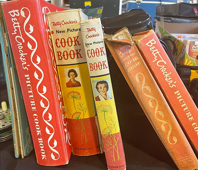 Vintage cookbooks stand at attention, their spines telling tales of dinner parties past and recipes that defined generations. Betty Crocker never goes out of style.