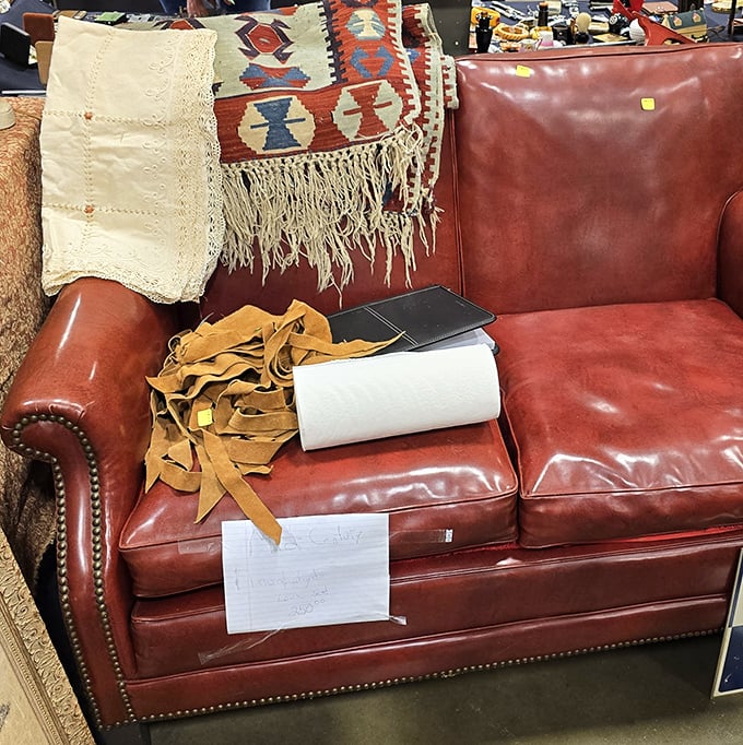 This leather loveseat has stories to tell, and for the right price, those stories can continue in your living room.