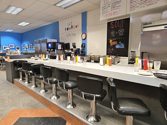 The counter where magic happens&mdash;classic soda fountain stools await your presence for burgers, shakes, and conversations that matter.