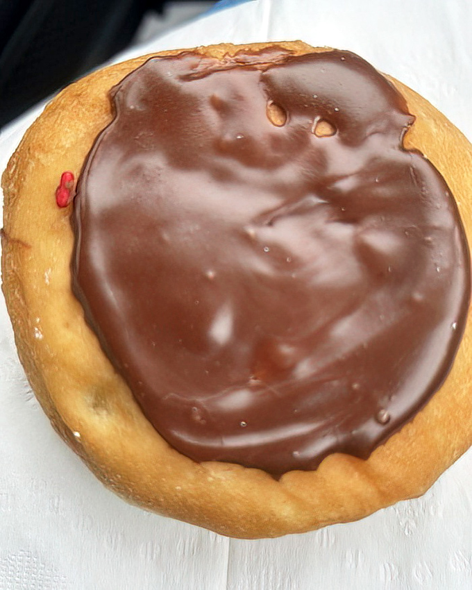 This chocolate-topped masterpiece isn't just a donut&mdash;it's therapy in circular form, with a glossy finish that reflects your own joy back at you.