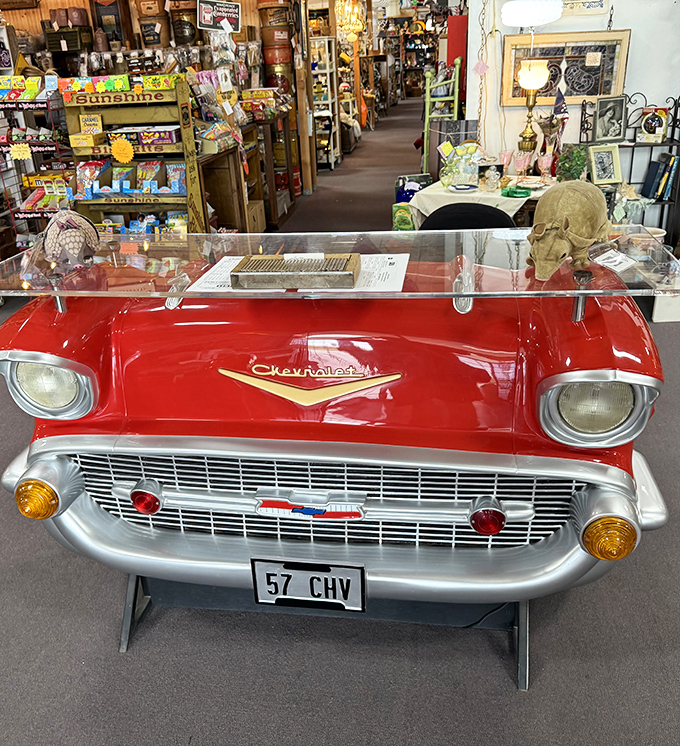 A cherry-red Chevrolet front end transformed into display case &ndash; Detroit steel meets retail genius.