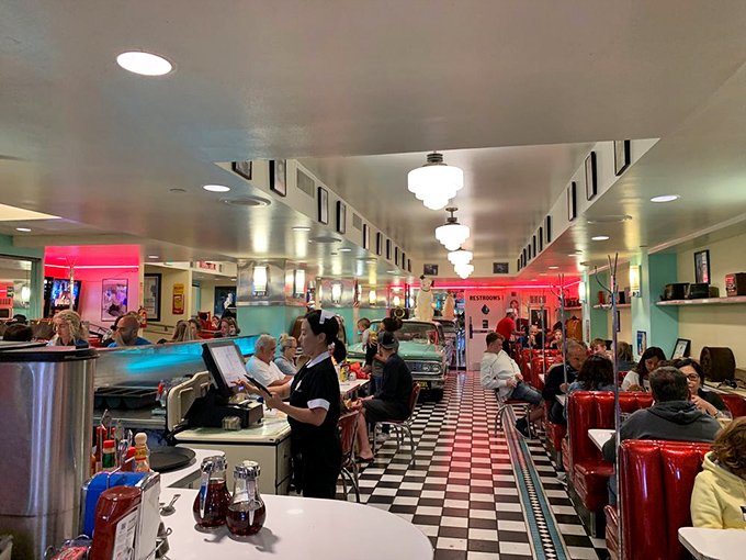 Where locals and tourists sit elbow to elbow, united by the universal language of "pass the ketchup, please."