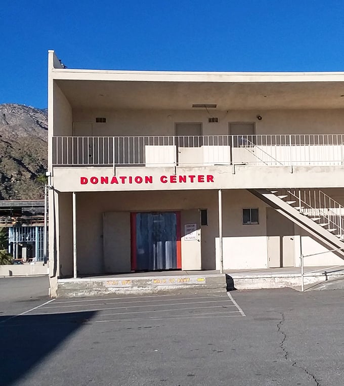 The donation center stands ready to receive yesterday's impulse buys and tomorrow's treasures. The circle of thrift continues under desert skies.