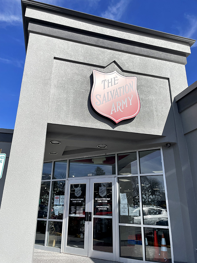 The welcoming entrance, crowned with the iconic Salvation Army shield. Like the pearly gates for bargain hunters, these doors open to secondhand heaven.