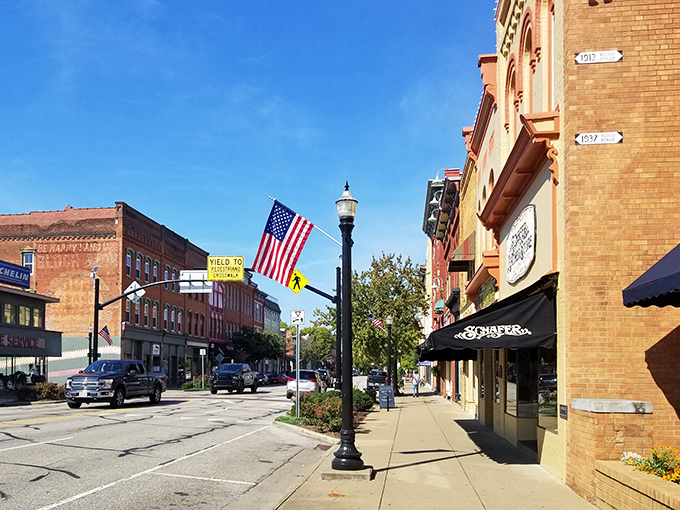 American flags flutter along Marietta's main street, where the brick buildings and vintage lampposts create a scene Norman Rockwell would have rushed to paint.